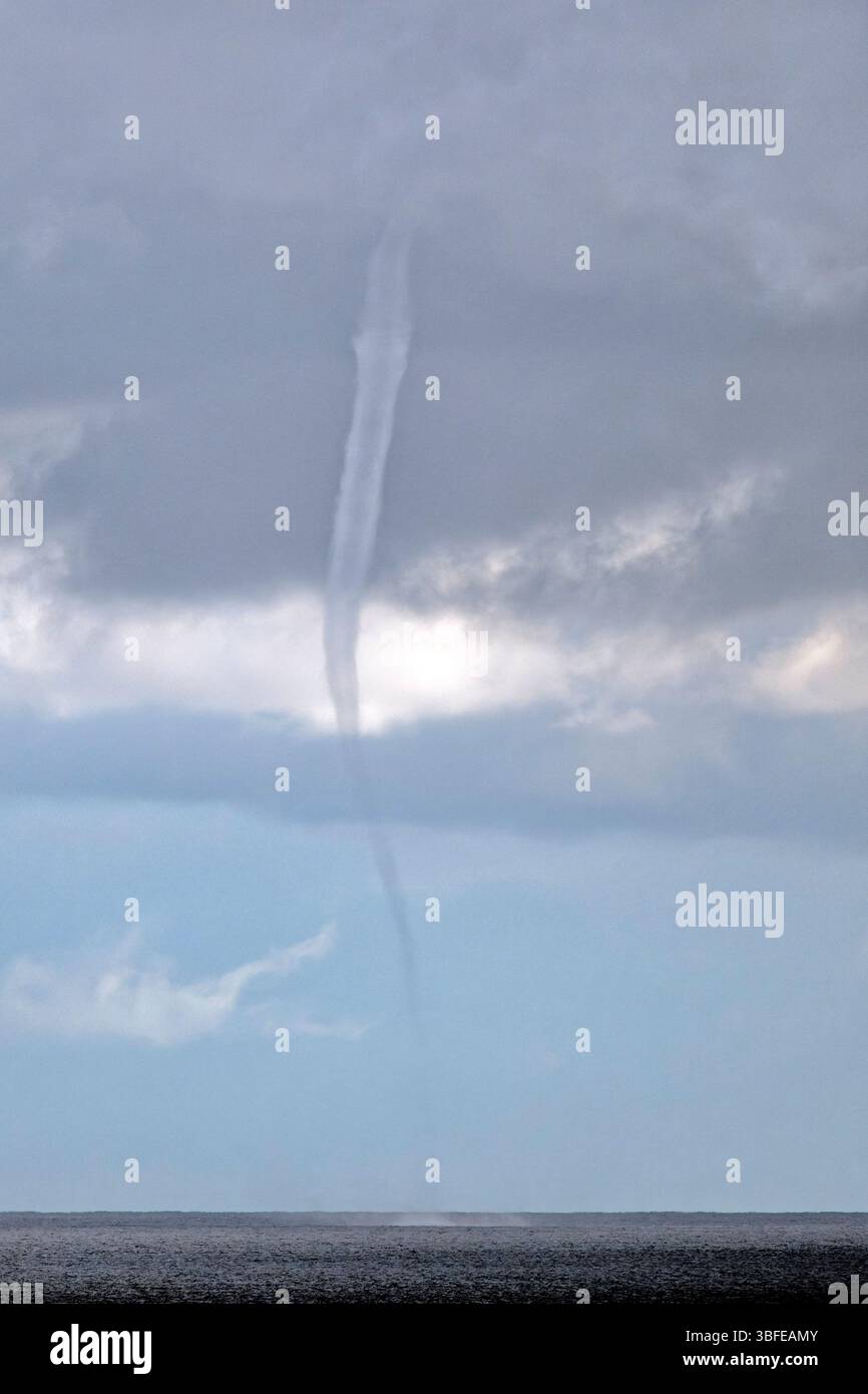 A waterspout weather phenomenon seen off Raiatea, French Polynesia ...