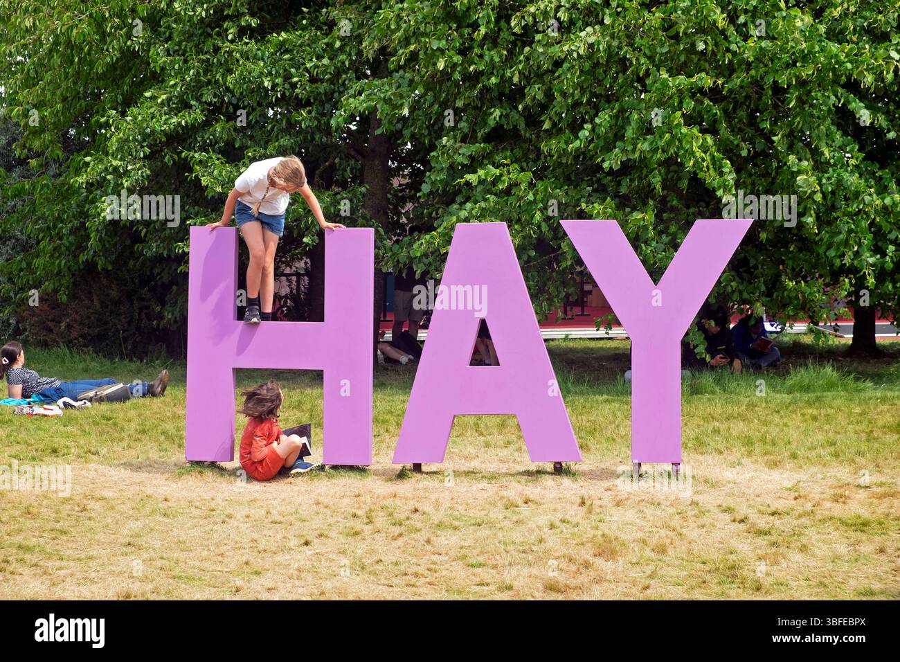 Girl child reading book kids children girls climbing playing on sittng ...