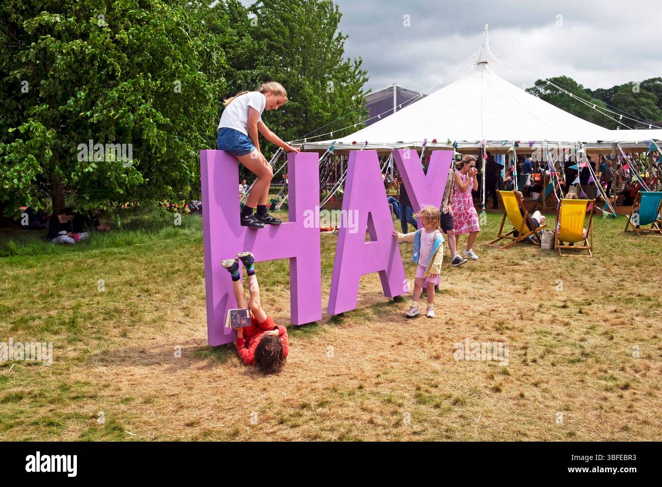 Girl child reading book kids children girls climbing playing on lying ...