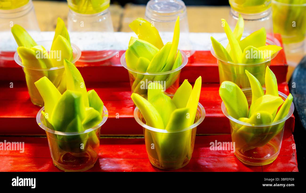 Pickled mango in plastic cups hi-res stock photography and images - Alamy
