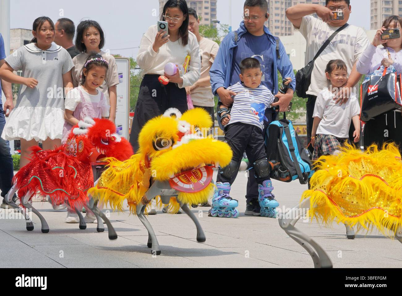 YANTAI, CHINA - JUNE 1, 2025 - People watched a Unitree Go2 robot dog ...