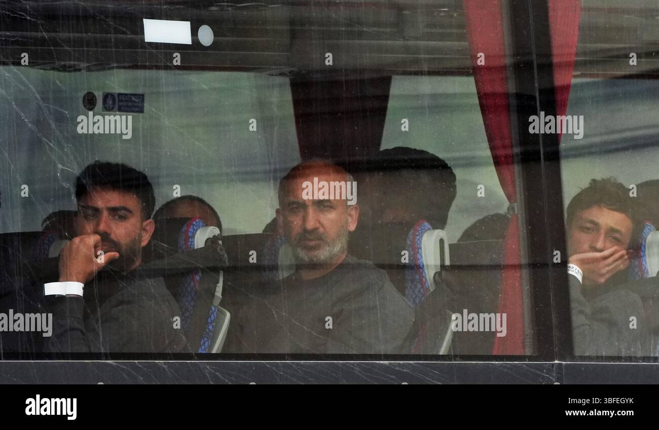 A group of people believed to be migrants are driven away from the ...