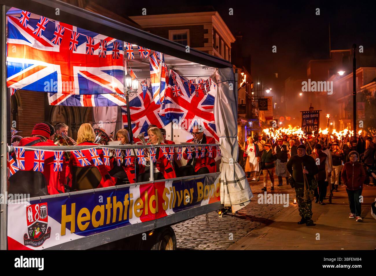 Local People Take Part In A Torchlight Procession Through The Streets ...