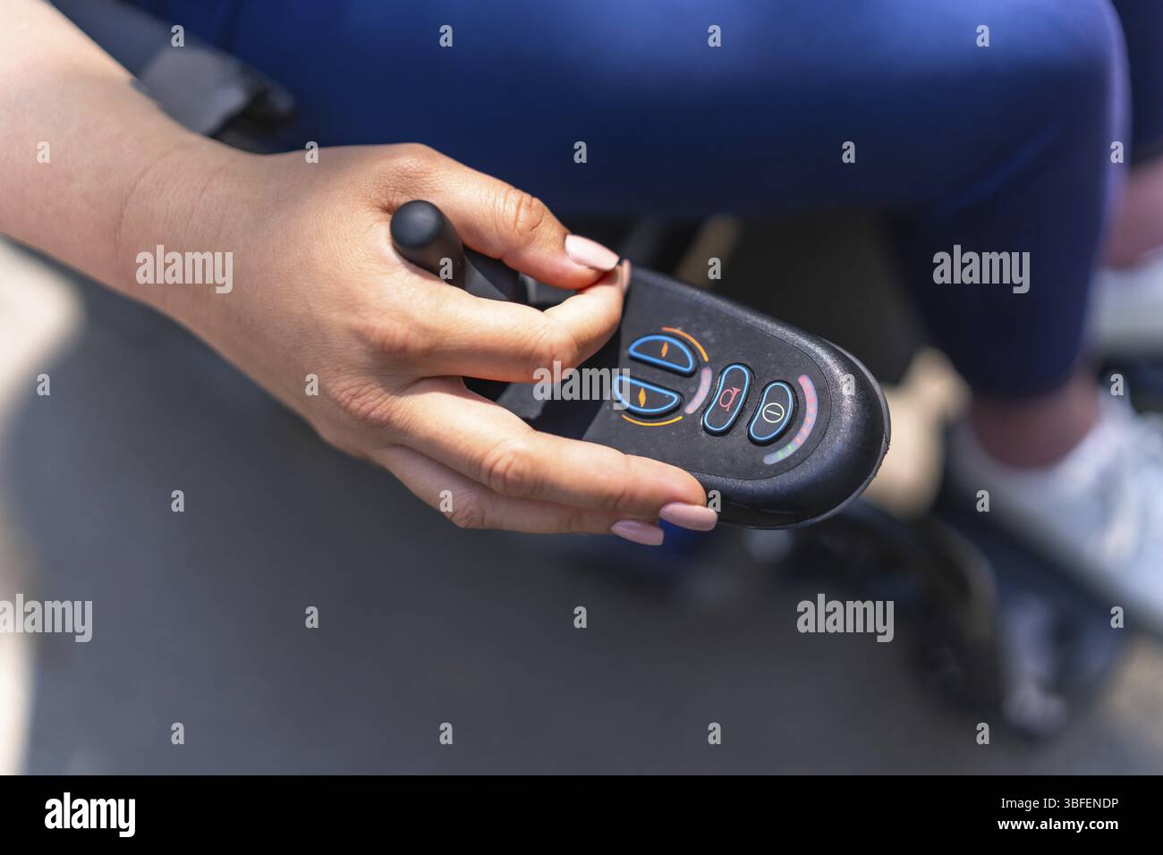 Close up of a woman's hand operating the joystick controller of her ...