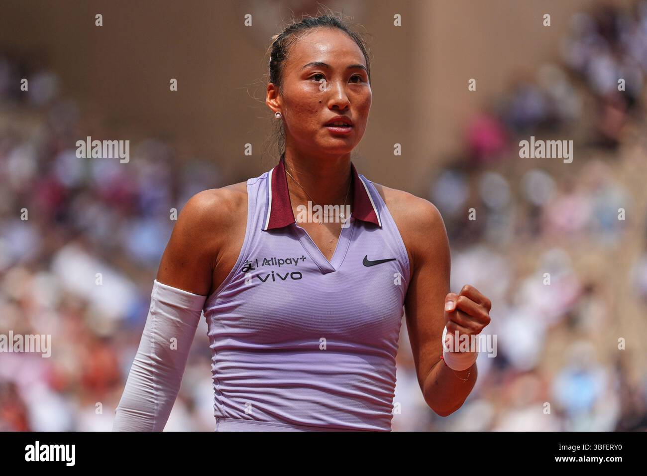 China's Zheng Qinwen reacts winning a point to Russia's Liudmila Samsonova during their fourth ...