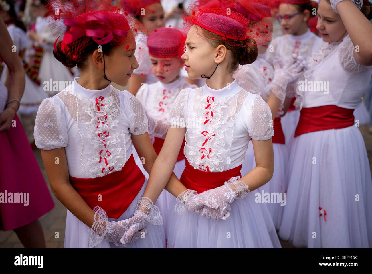 Students of a dance school strike a pose outside Romania's Palace of ...