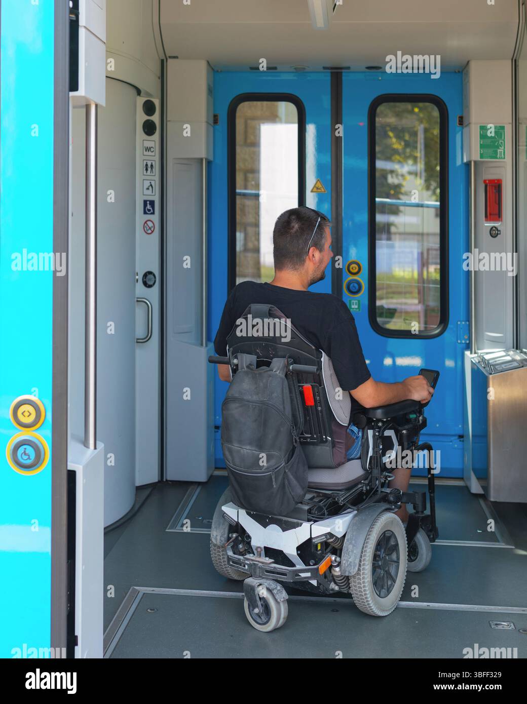 Wheelchair user using accessible train travel navigates through the ...