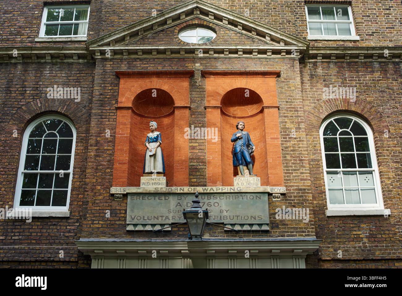 Figures on the front of the old St John of Wapping Charity School on ...
