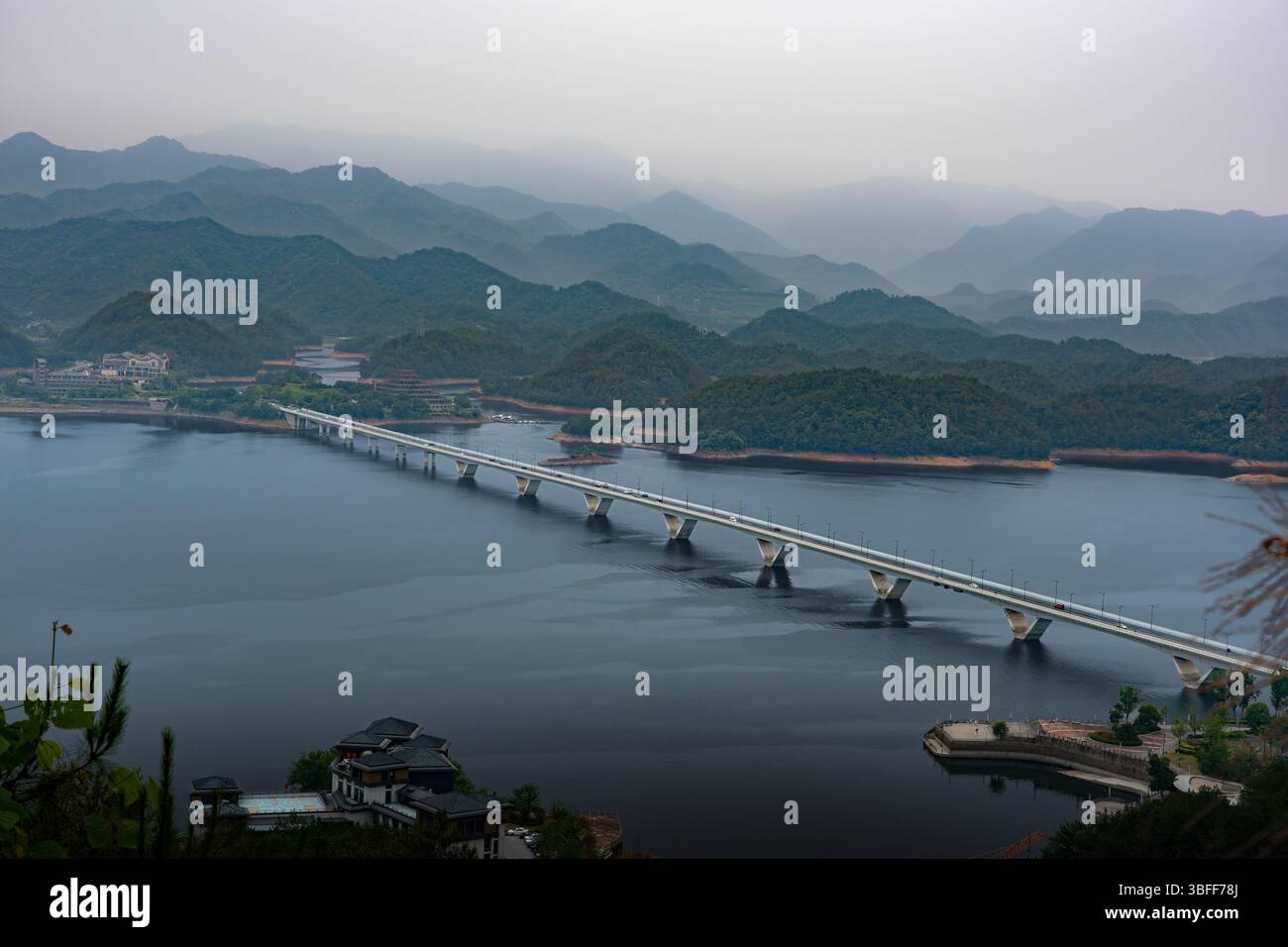 Misty Bridge Over Qiandao Lake on Rainy Day Stock Photo - Alamy