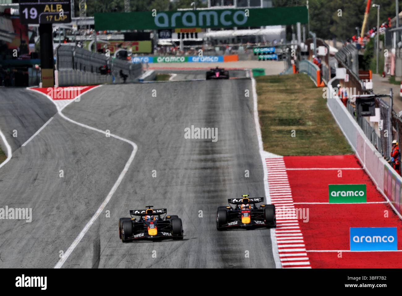 Max Verstappen (NLD) Red Bull Racing RB21 and Yuki Tsunoda (JPN) Red ...