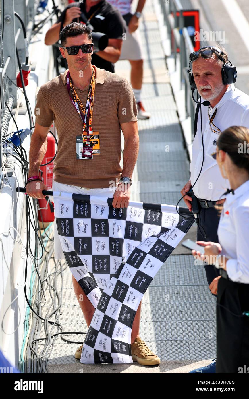 Robert Lewandowski (POL) Football Player with the chequered flag at the end of the race. 01.06. ...