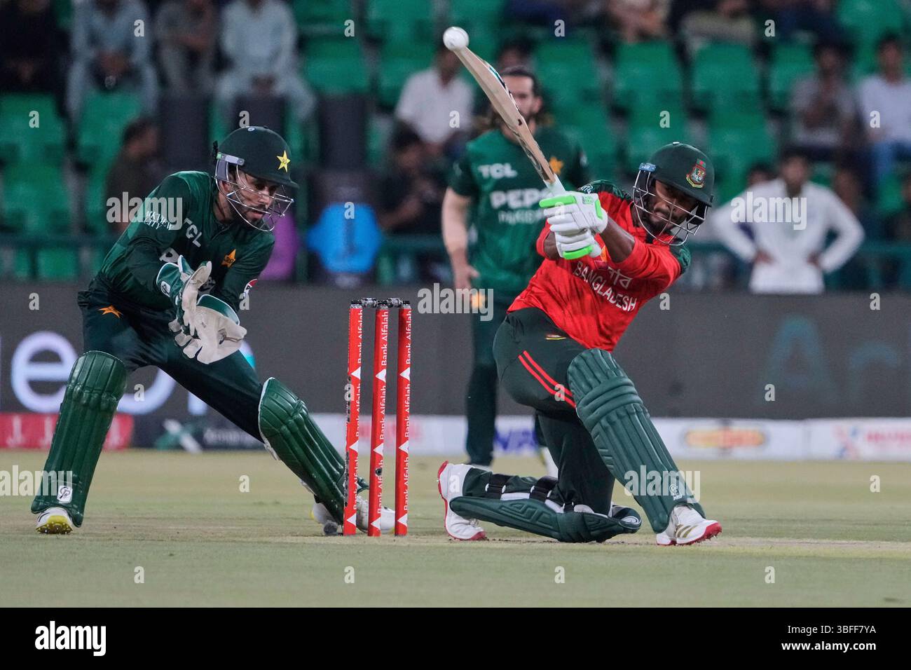 Bangladesh's Tanzid Hasan Tamim, rights, plays a shot as Pakistan's ...