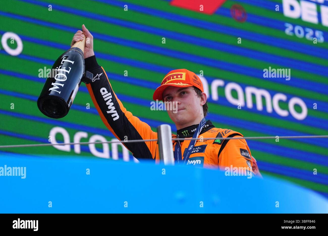 McLaren's Oscar Piastri celebrates on the podium after finishing first ...