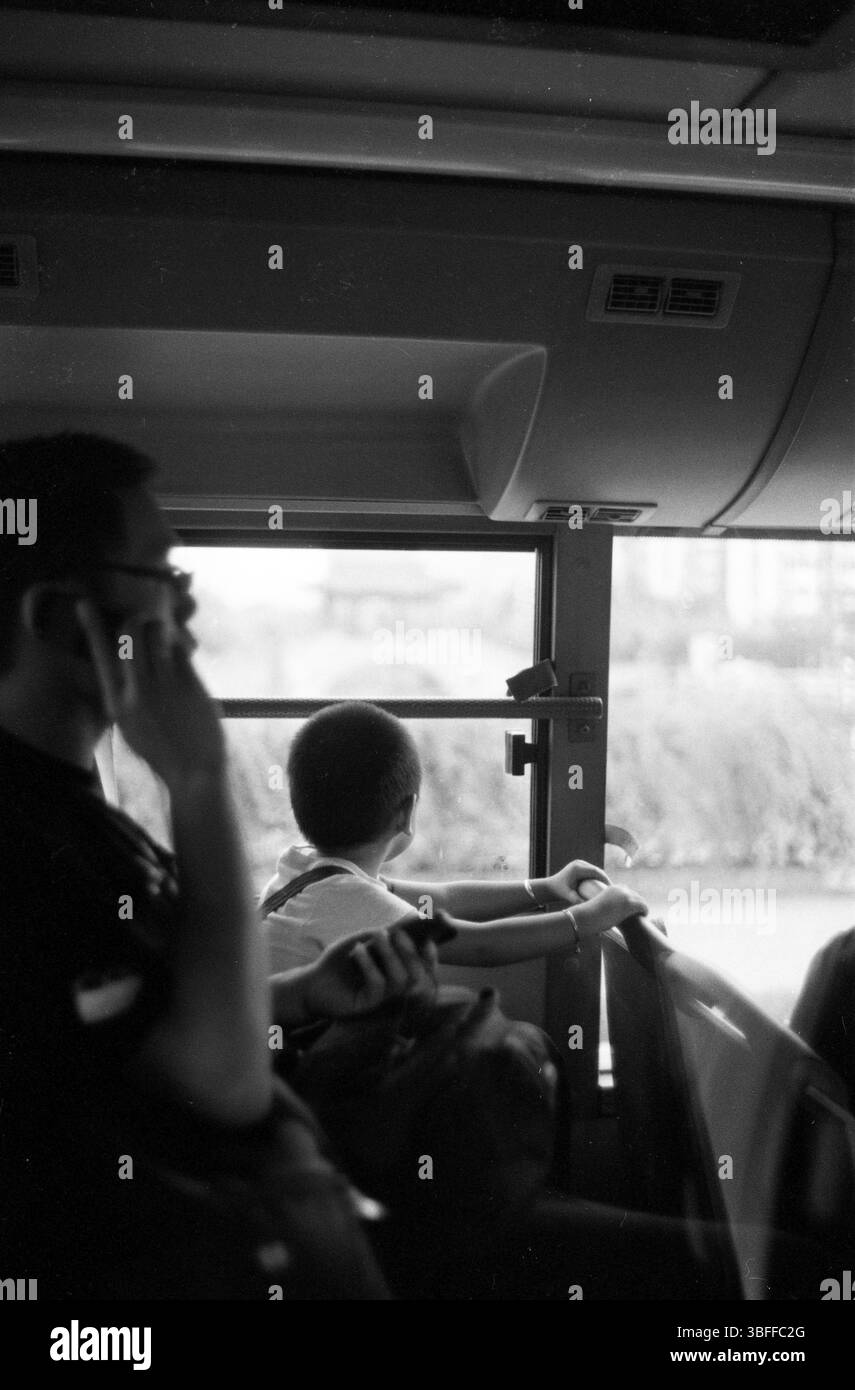 Early-2010s Hangzhou Bus Scene—Businessman on Constant Calls While ...