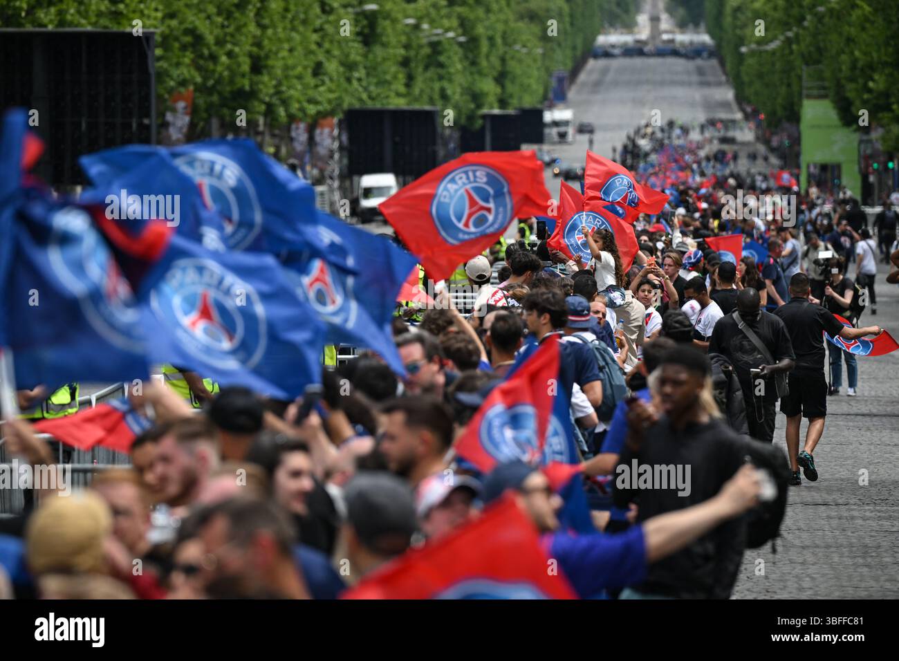 Paris Saint-Germain’s supporters arrive to receive the PSG players in a ...