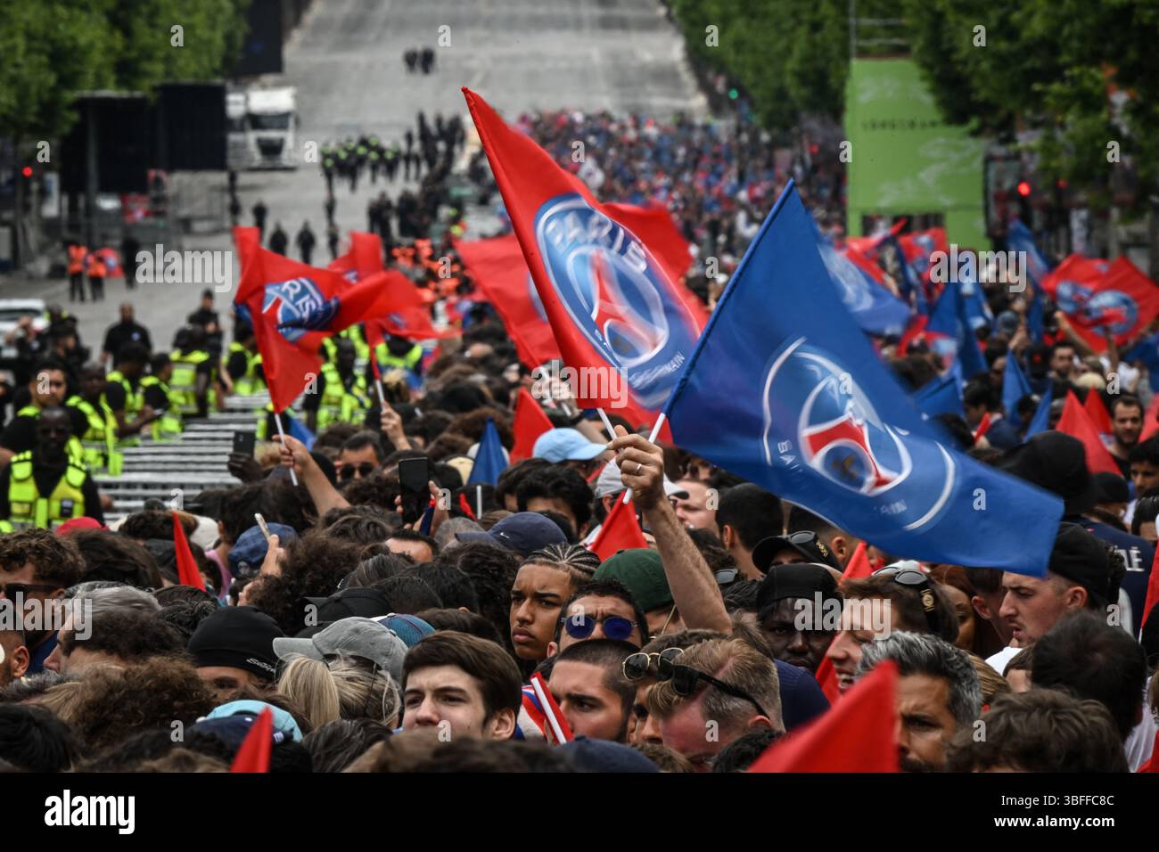 Paris Saint-Germain’s supporters arrive to receive the PSG players in a ...