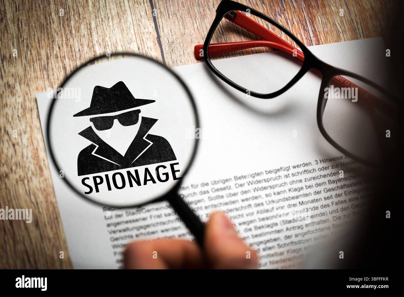 Bavaria, Germany - 01 June 2025: PHOTOMONTAGE, A spy symbol under the ...