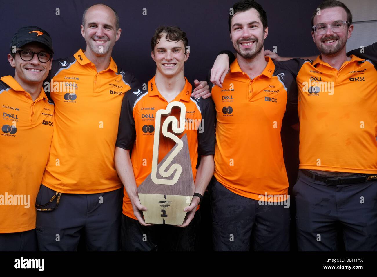 First place McLaren's Oscar Piastri celebrates with the trophy and the ...