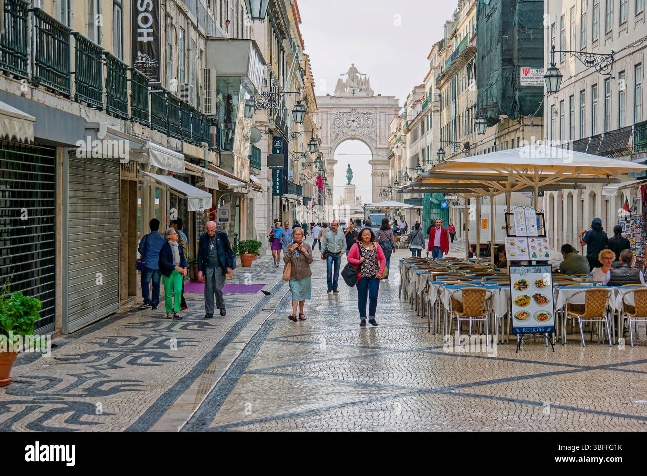 A street scene in Lisbon, Portugal, featuring a pedestrian walkway ...