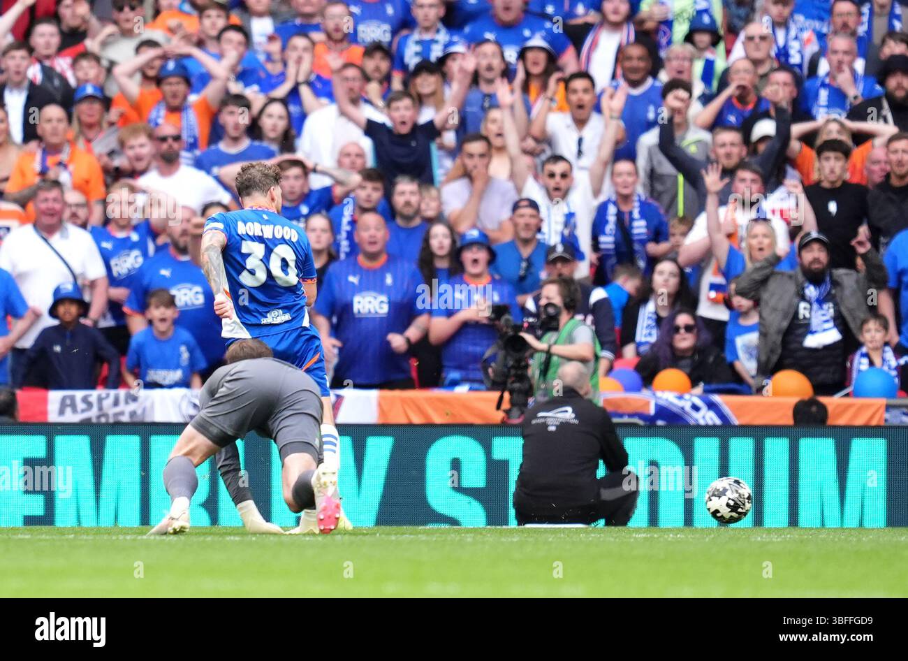 Oldham Athletic's James Norwood scores their side's second goal of the ...