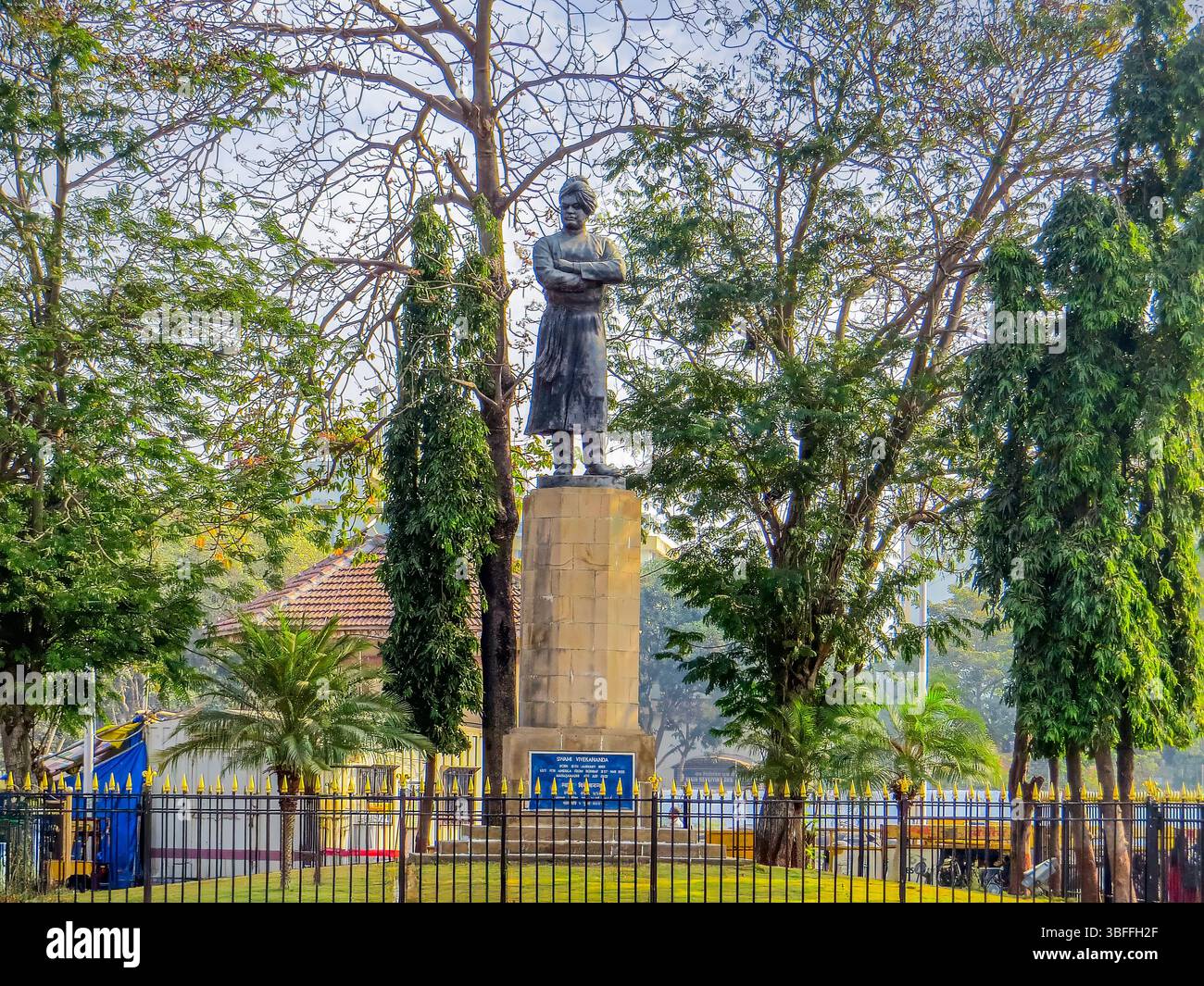 Mumbai. Statue of Swami Vivekanand with Taj Mahal hotel complex in background near Gateway of ...