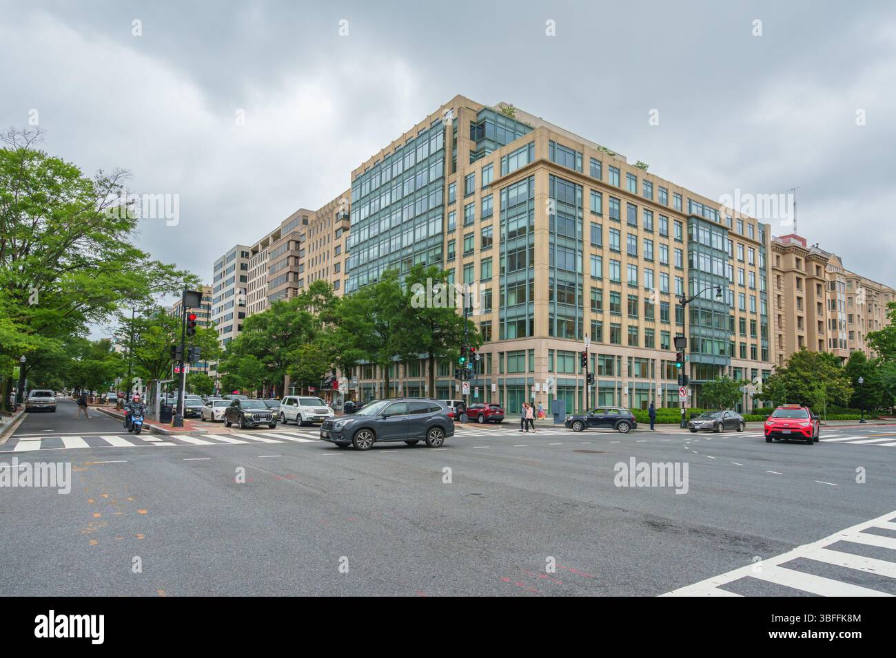 Washington D.C., USA - May 21, 2025. Wide city street lined with modern ...
