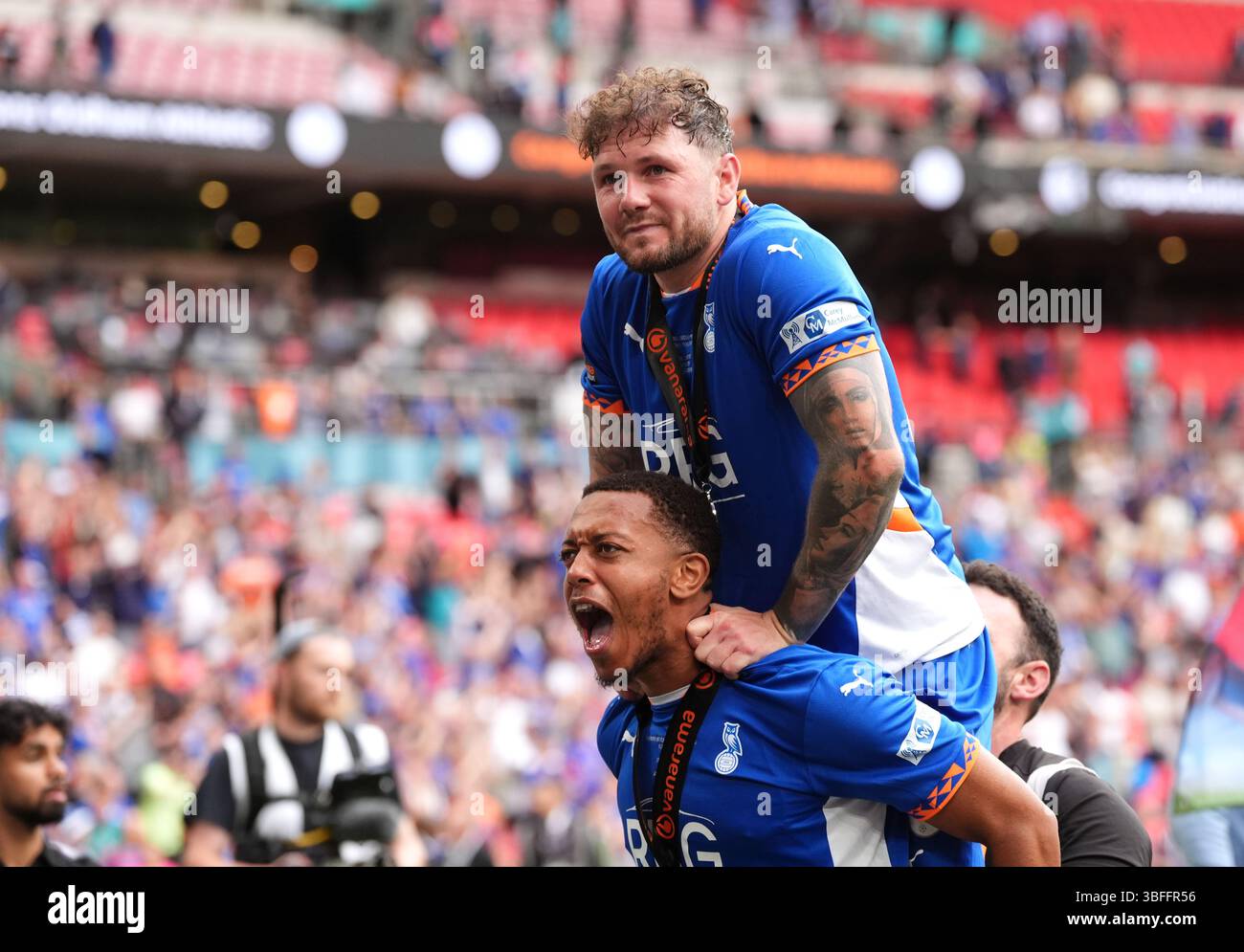 Oldham Athletic's Shaun Hobson and James Norwood celebrate promotion to ...