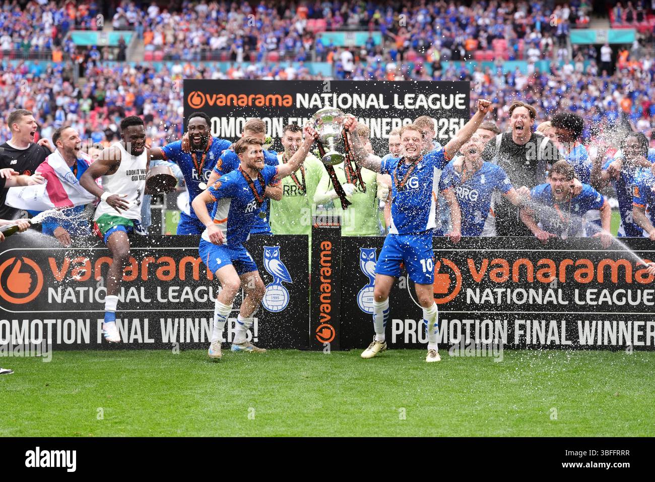 Oldham Athletic players celebrate with the trophy following the ...