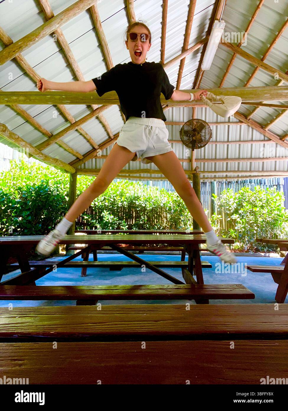 Eleven year old girl jumping for joy Stock Photo - Alamy