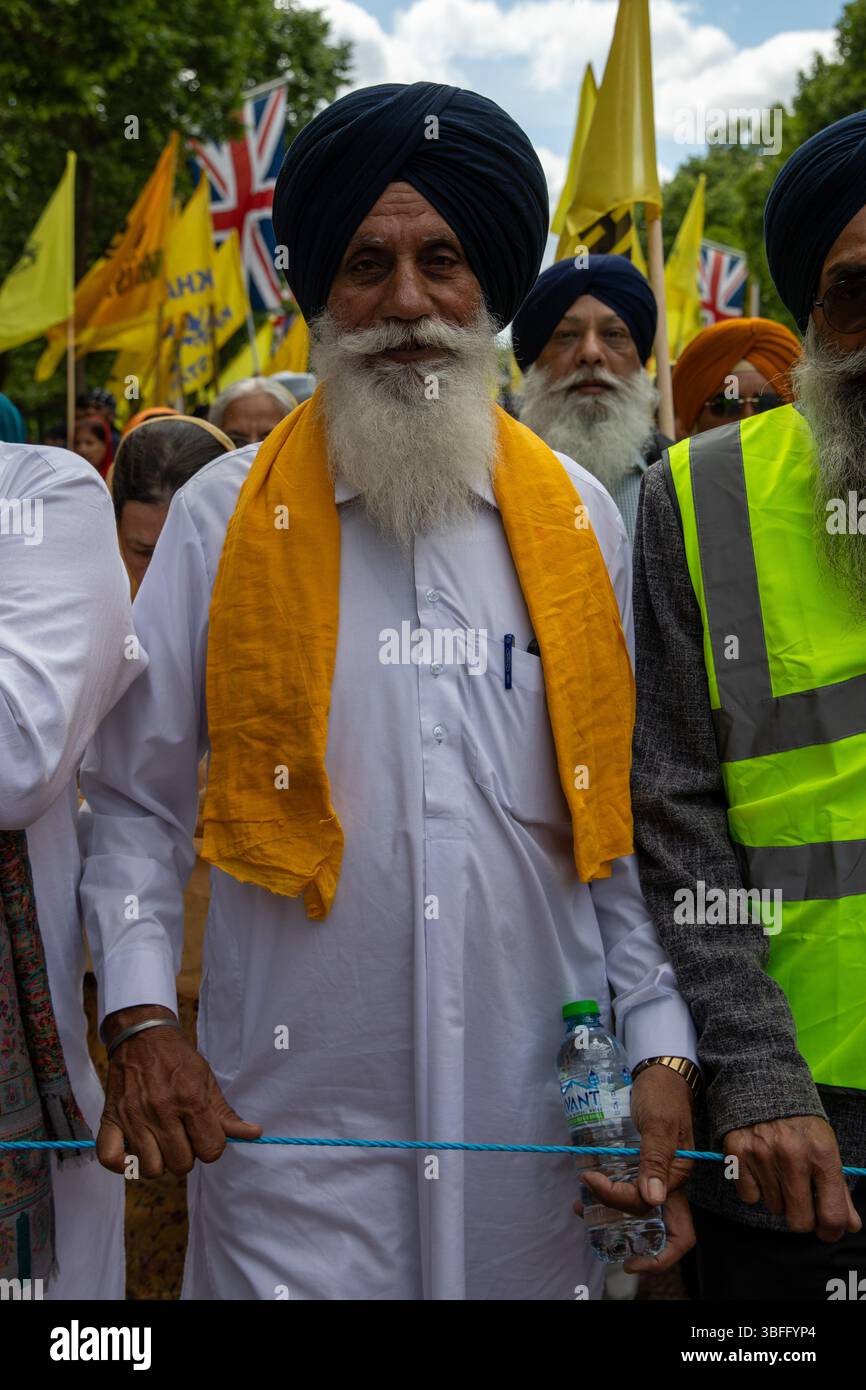 A British Sikh stands seen at the front of a march during a rally ...
