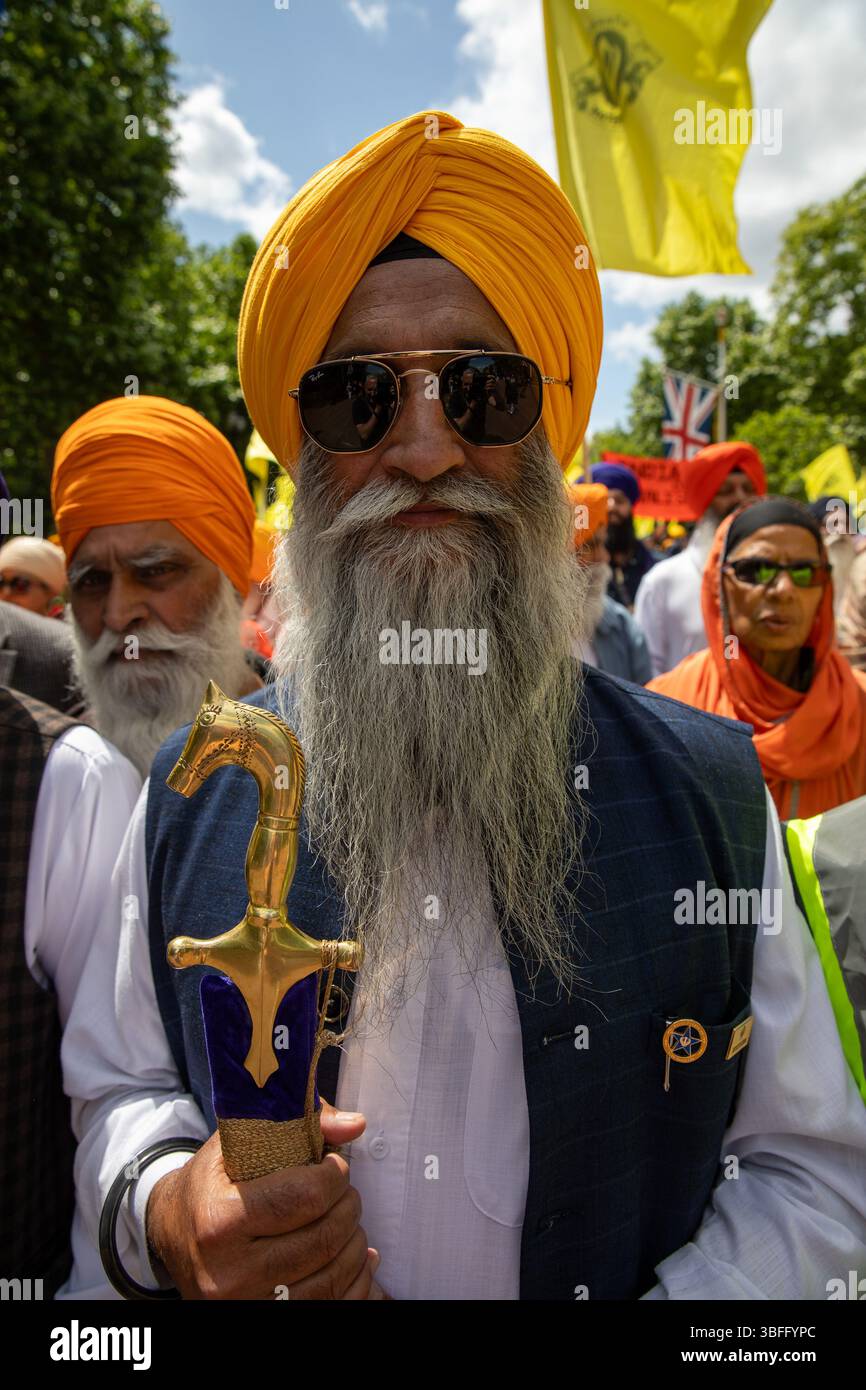 A British Sikh stands at the front of a march. Thousands of British ...