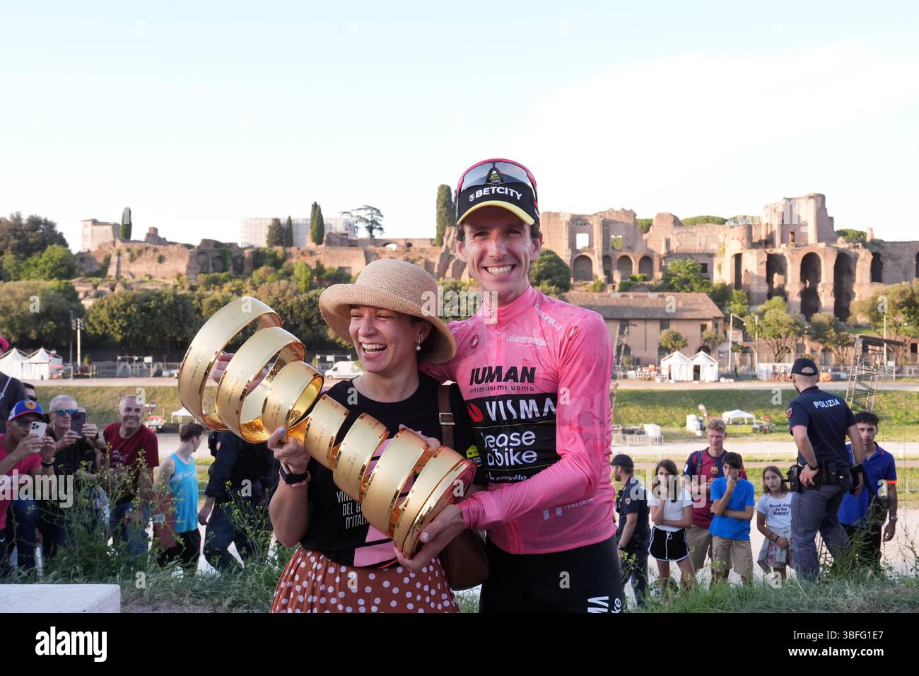 Britain's Simon Philip Yates on the podium, wearing the pink jersey of ...