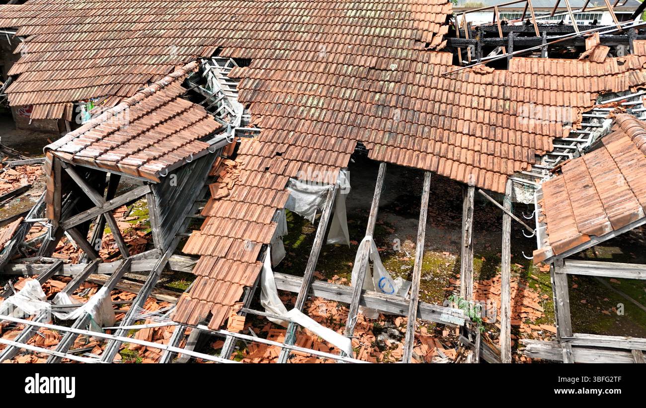 an old collapsed tiled roof as an aerial photograph Stock Photo - Alamy