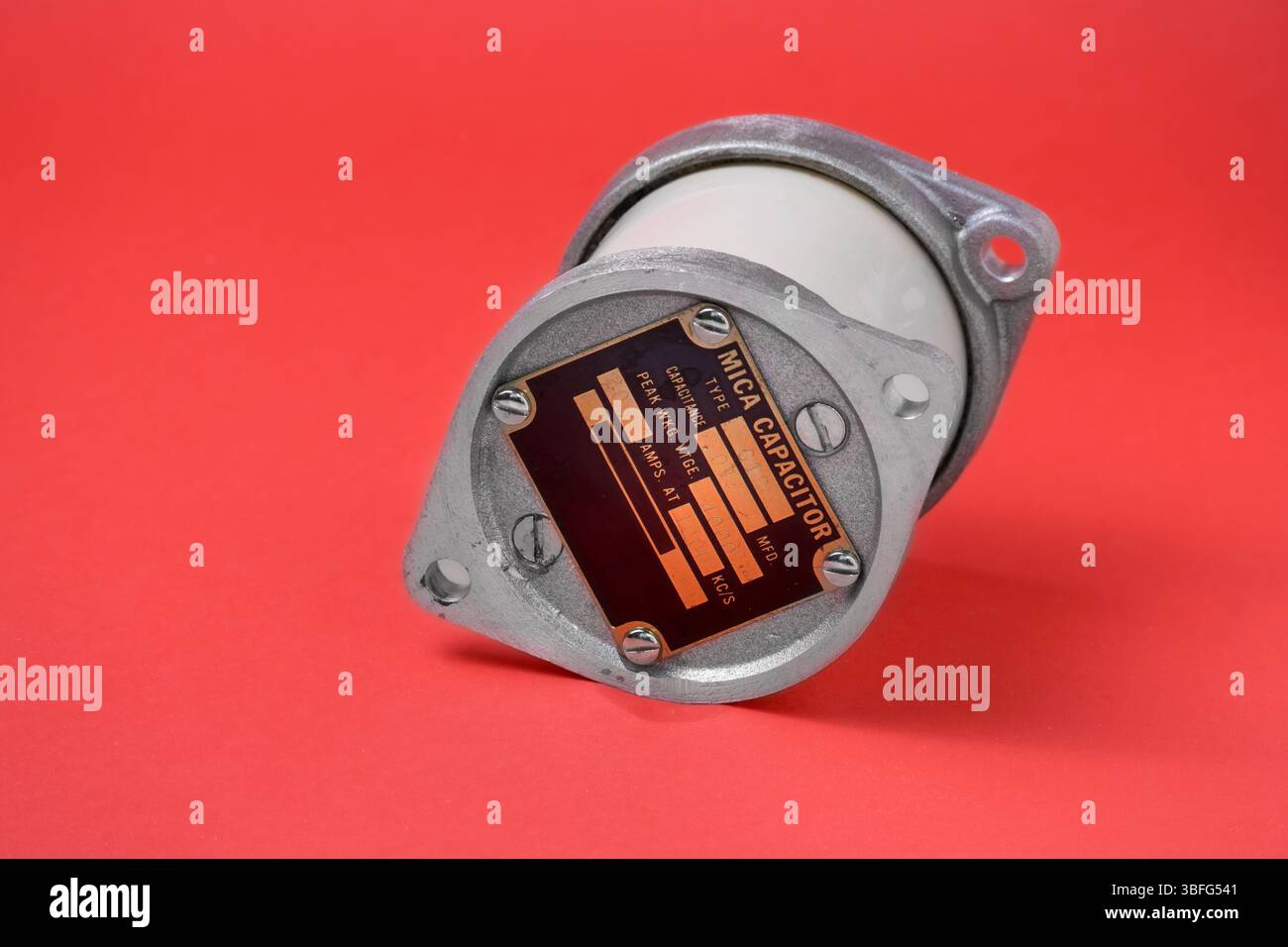 antique high voltage mica capacitor with a metallic casing and label detailing its ...