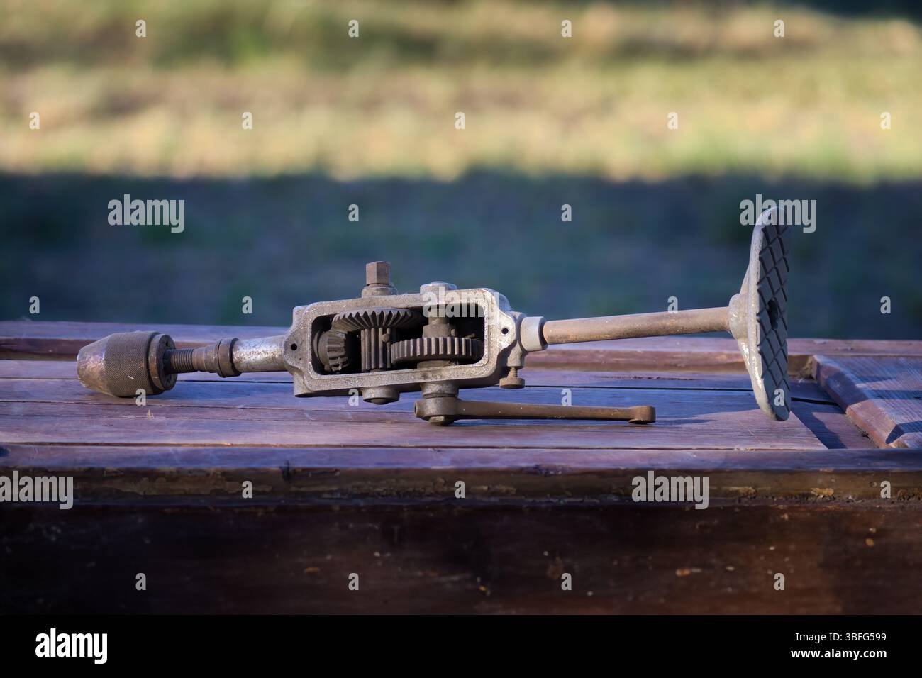 Worn Antique Hand-Cranked Drill with Exposed Gears Stock Photo - Alamy