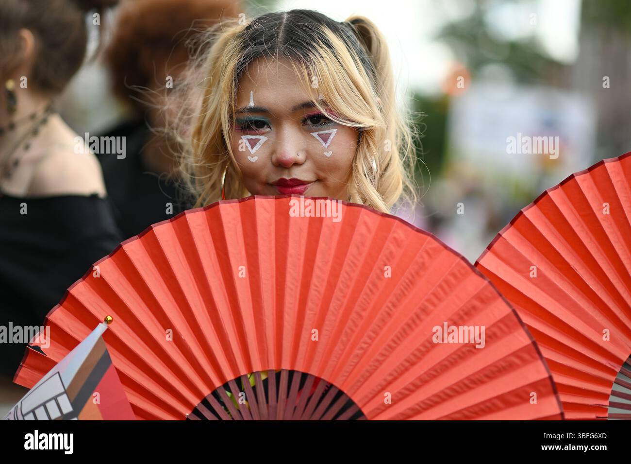 People take part in The New Queens Pride Parade in the neighborhood of ...