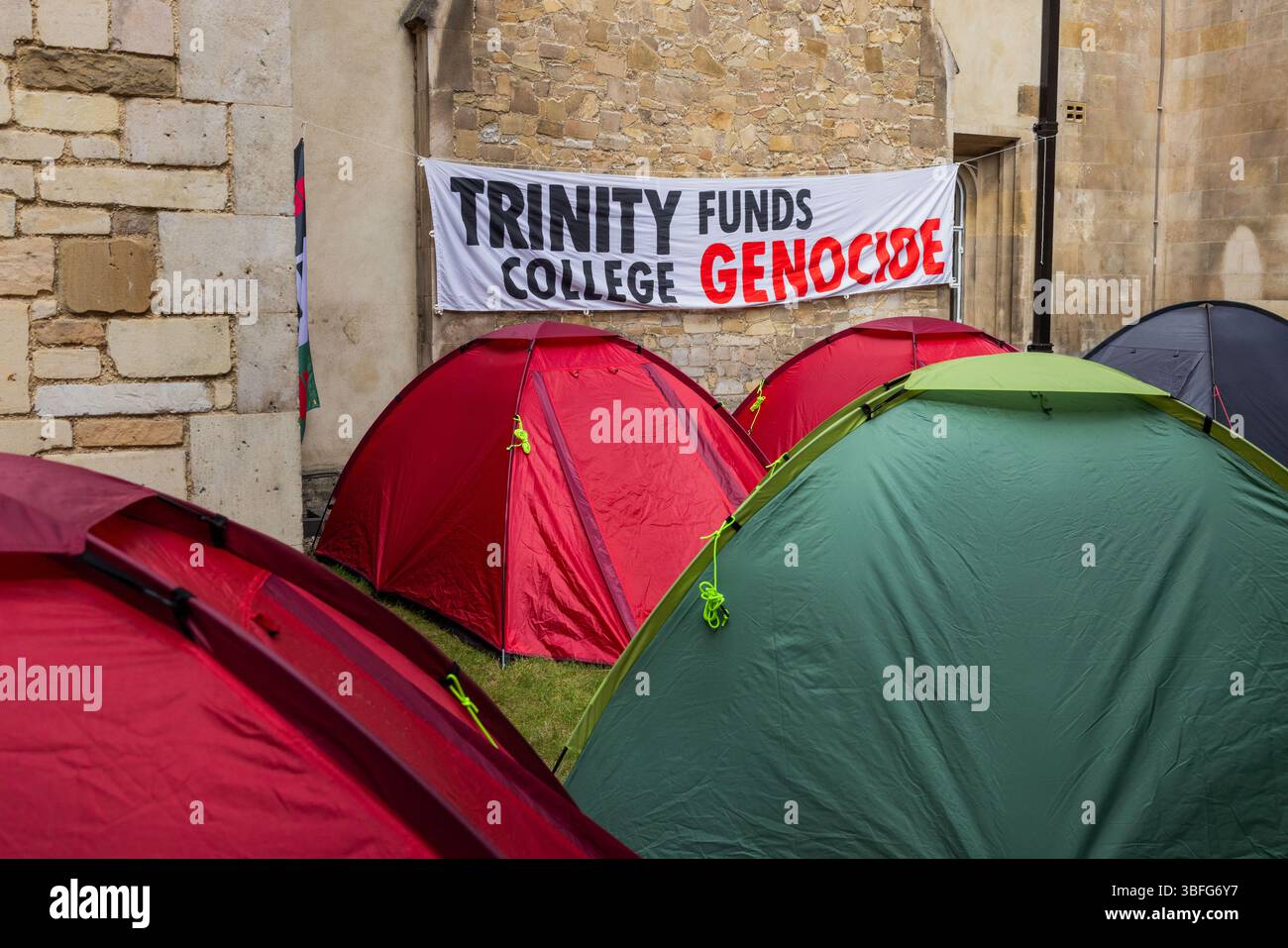 Cambridge, UK. 01 JUN, 2025. Tents and "Trinity college funds Genocide" banner on day two of a ...