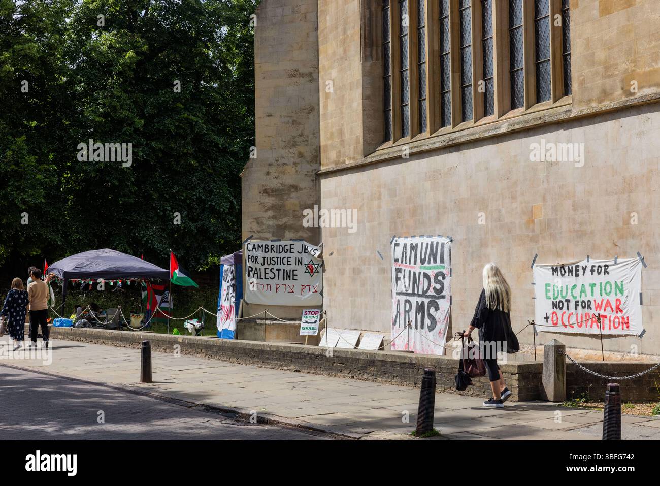 Cambridge, UK. 01 JUN, 2025. People walk past signs on day two of a ...