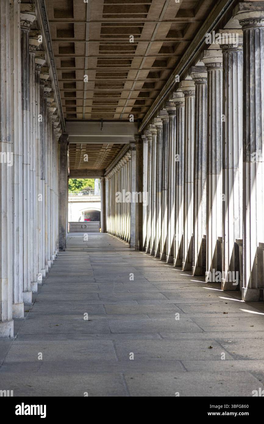 Symmetrical Stone Colonnade with Natural Light. A long, empty stone ...