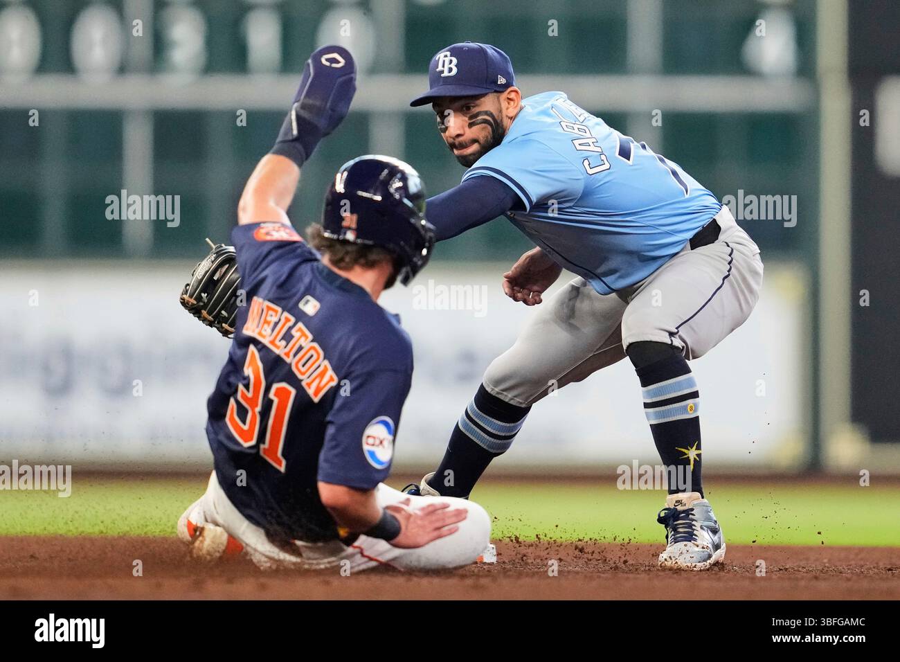 Tampa Bay Rays shortstop Jose Caballero, right, tags out Houston Astros ...