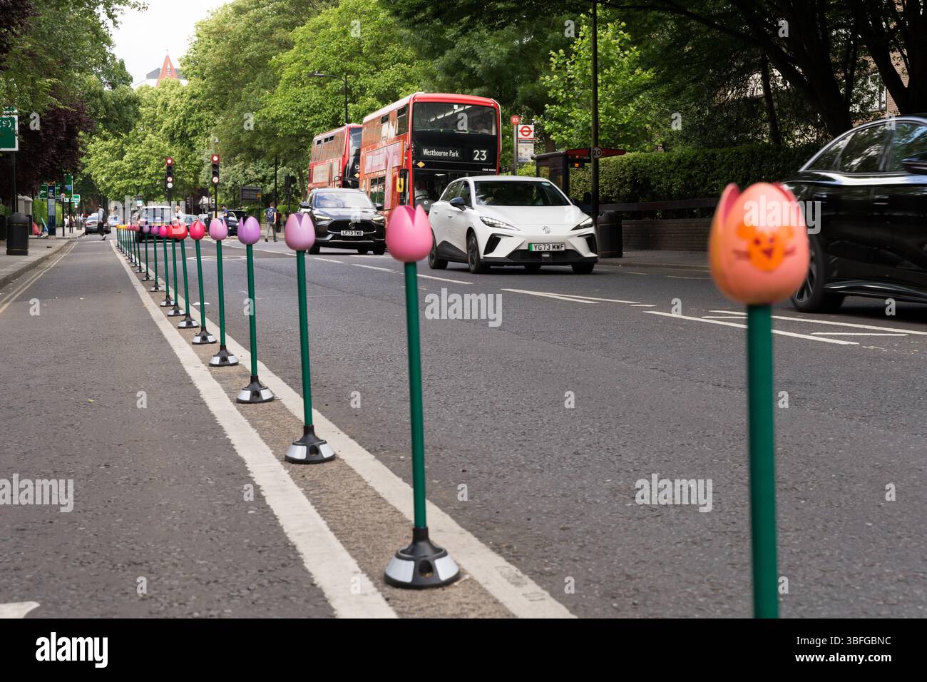 London, UK – 1st June 2025: A row of colorful plastic tulips has sprung ...