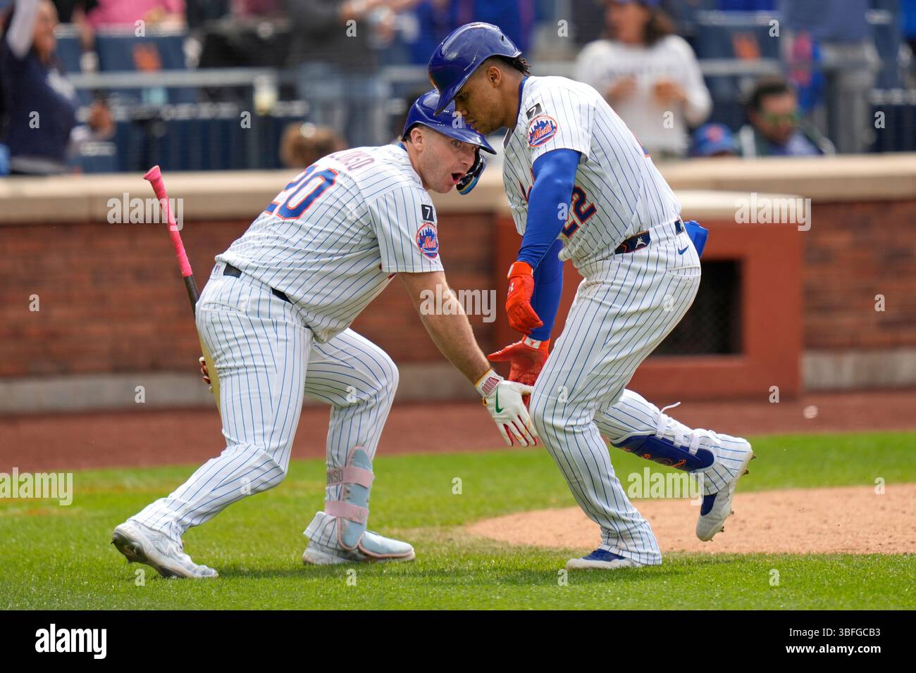 New York Mets' Pete Alonso, left, greets Juan Soto after Soto hit a ...