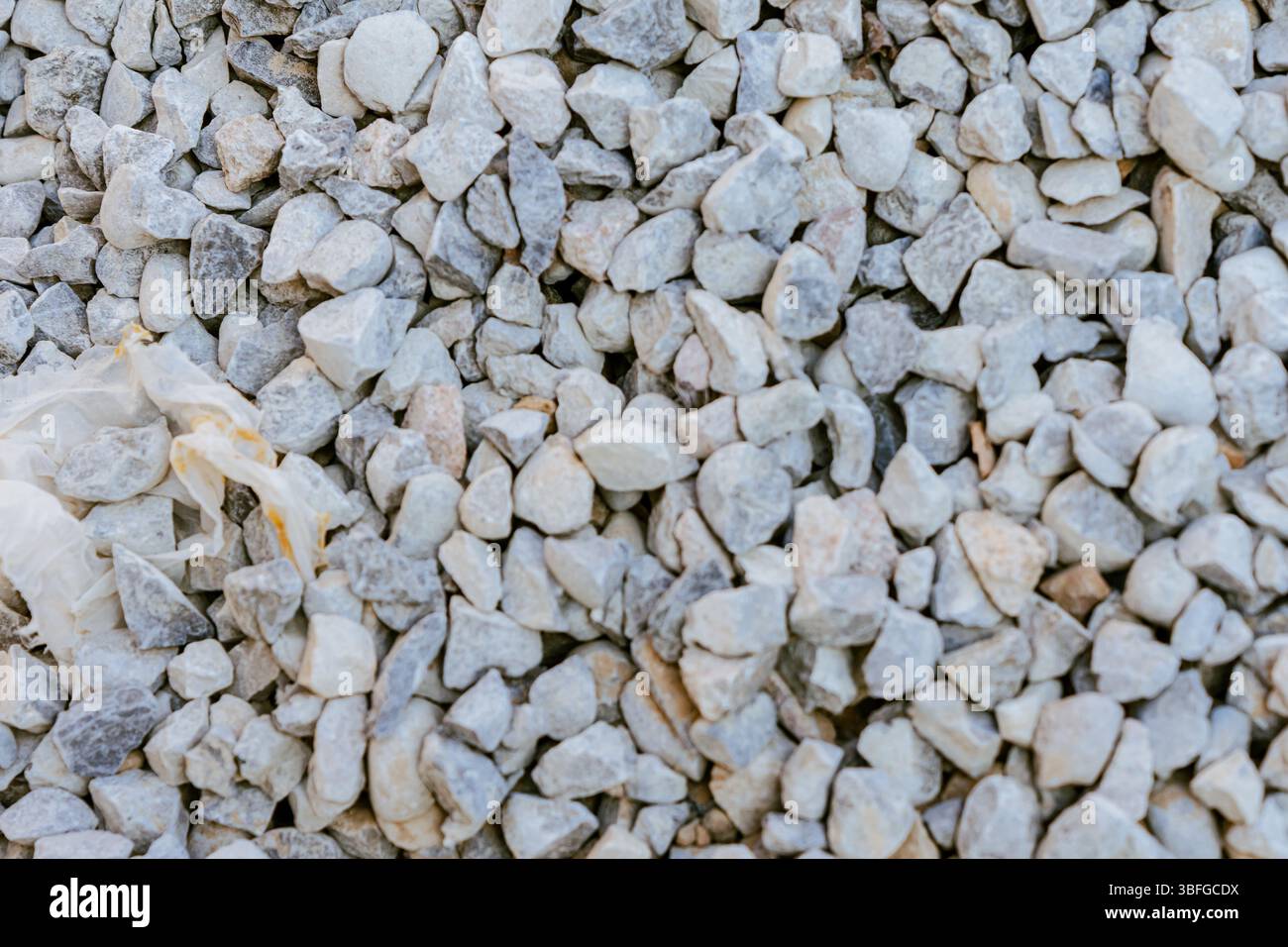 Crushed rock. Small rocks ground. Crushed stone road building material ...