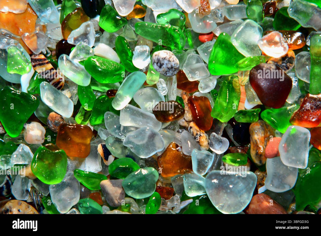 Sea glass, a harmonious blend of green, amber, brown and translucent colours Stock Photo - Alamy