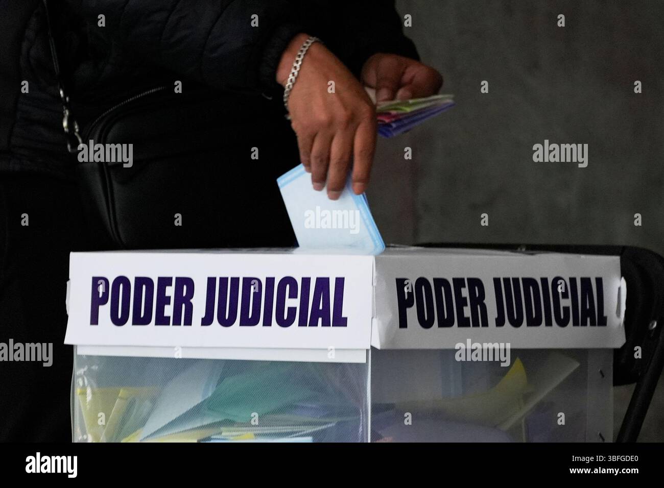 A voter casts their ballot in Mexico's first judicial elections, in ...