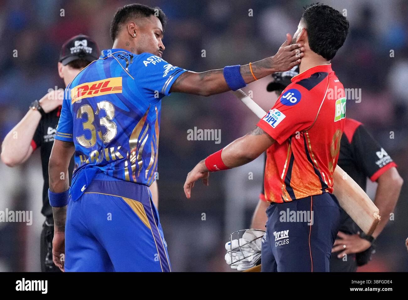 Mumbai Indians' captain Hardik Pandya, left, congratulates Punjab Kings ...