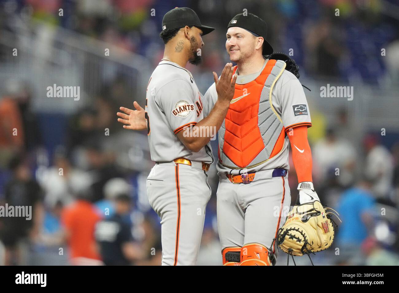 San Francisco Giants relief pitcher Camilo Doval, left, and catcher Patrick Bailey, right, meet ...