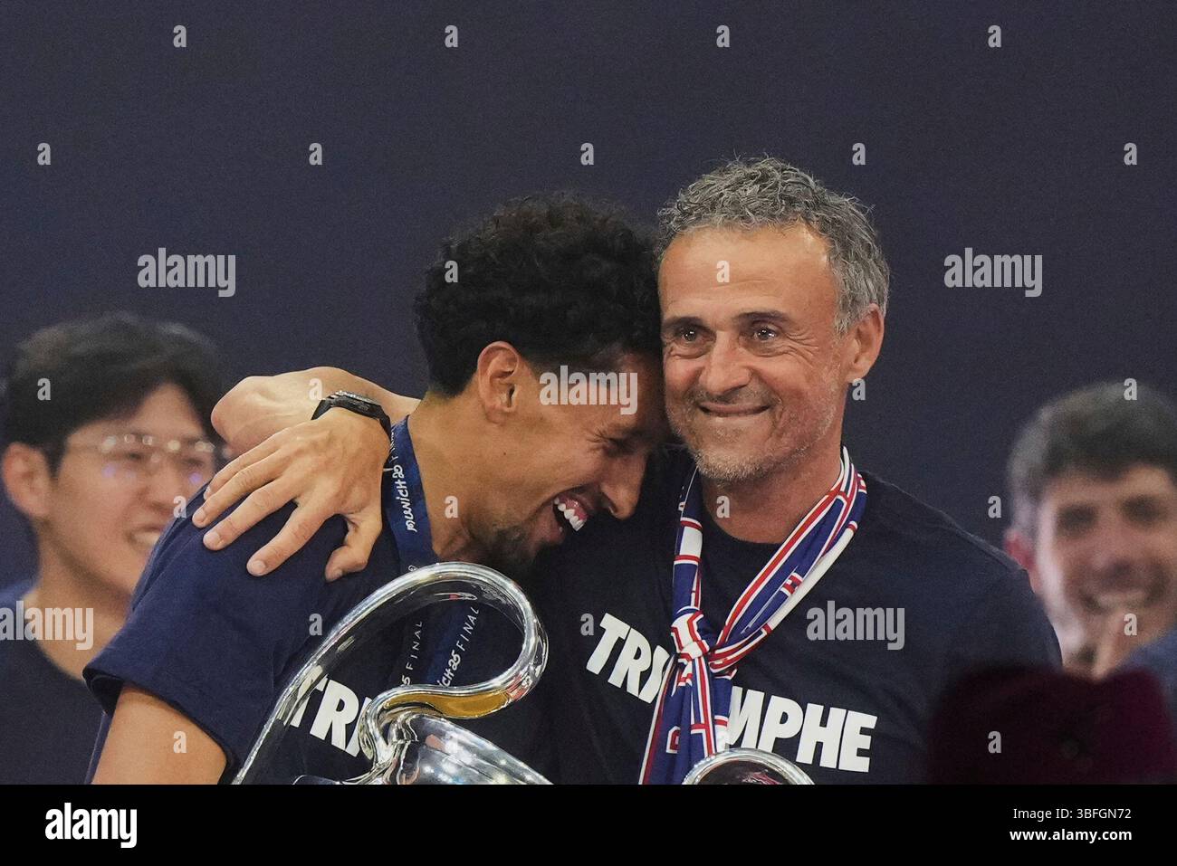 PSG's head coach Luis Enrique, right, hugs captain Marquinhos during a ...