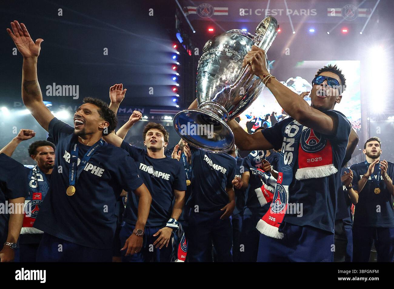 Paris Saint-Germain's French midfielder Desire Doue, right, holding the ...