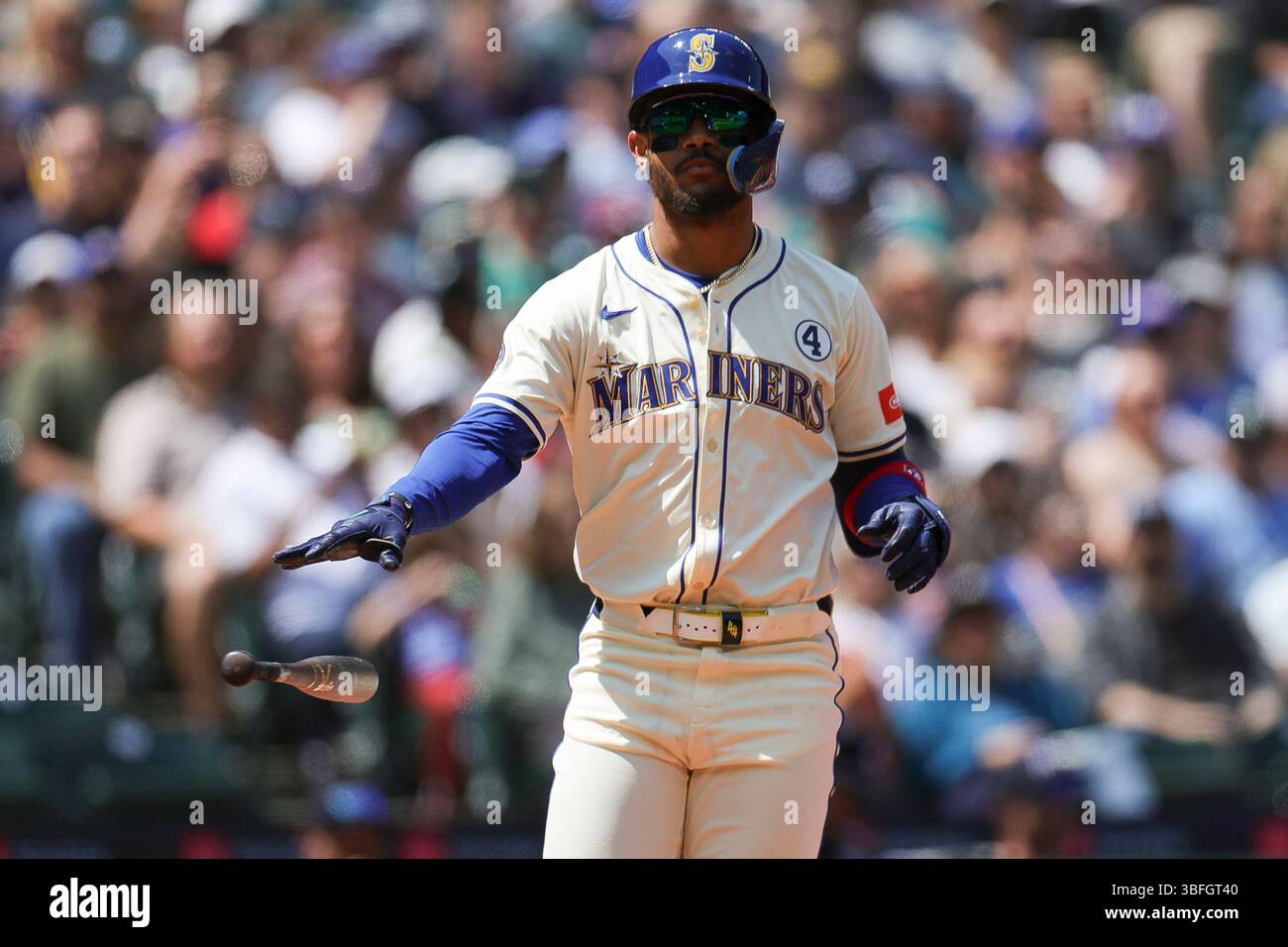 Seattle Mariners' Julio Rodriguez tosses his bat after drawing a walk ...